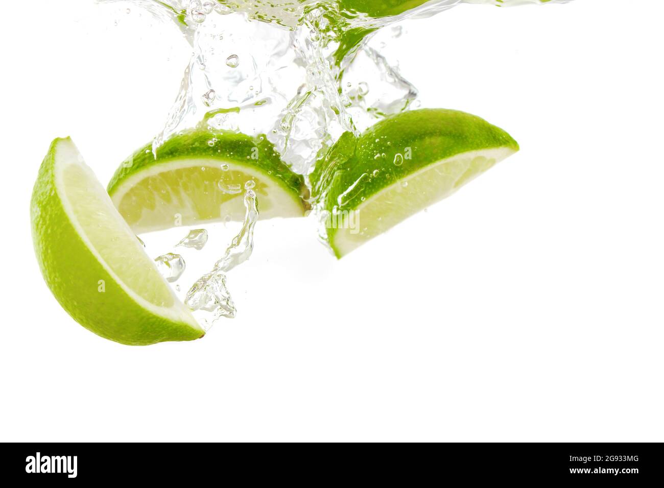 lime and lemon splashing water isolated on white background Stock Photo ...