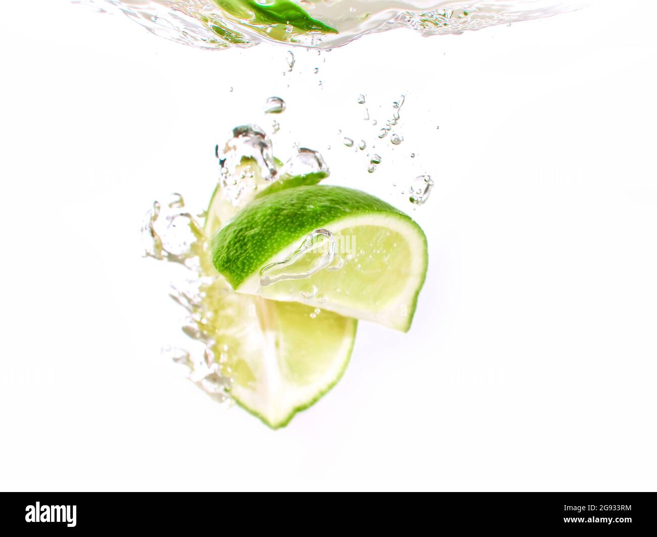 lime and lemon splashing water isolated on white background Stock Photo ...