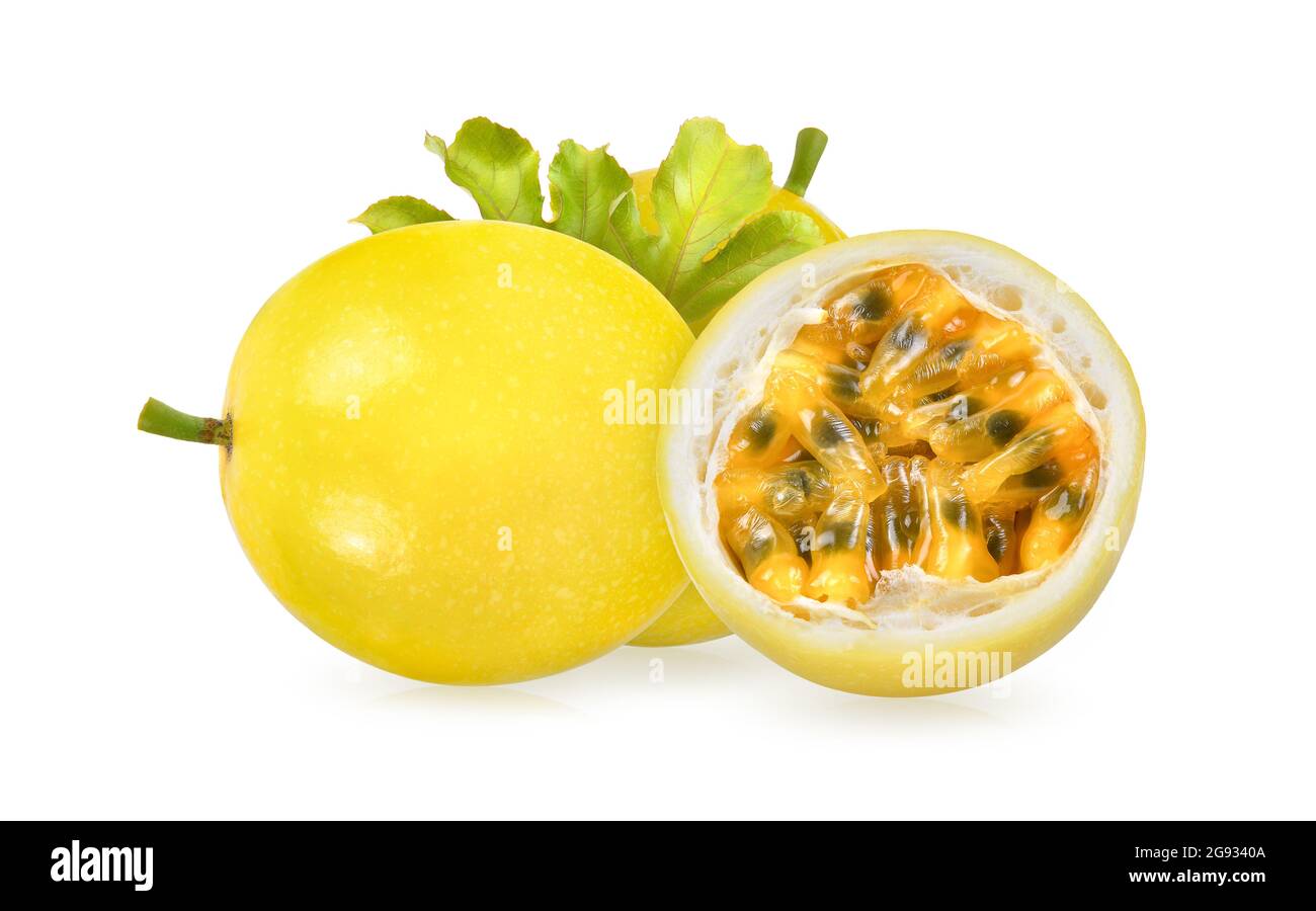 yellow passion fruit with leaf on white background Stock Photo - Alamy