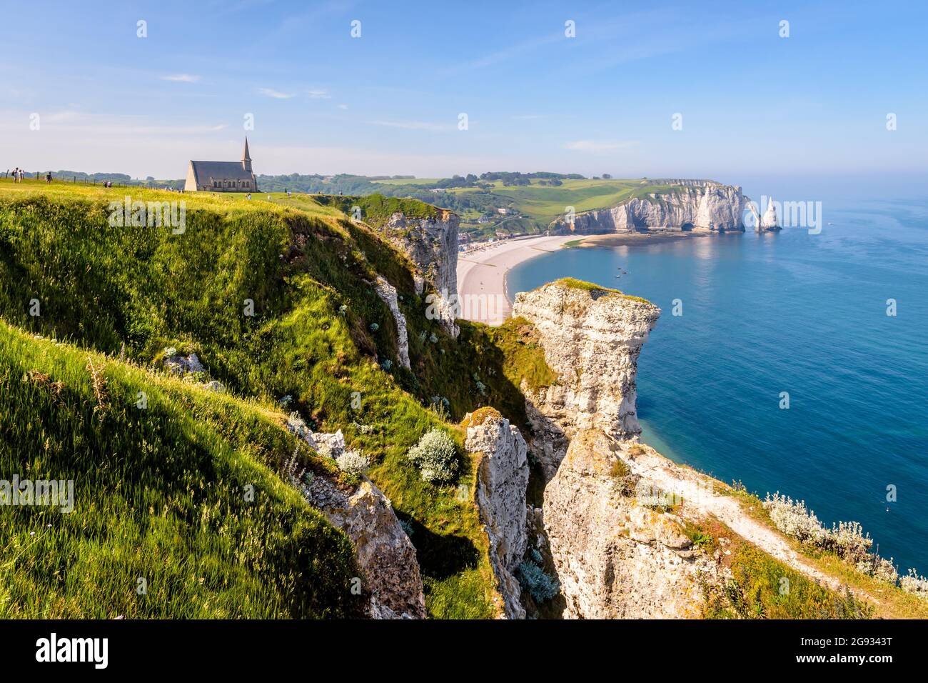 The cliffs in Etretat, Normandy, with Notre-Dame de la Garde chapel ...