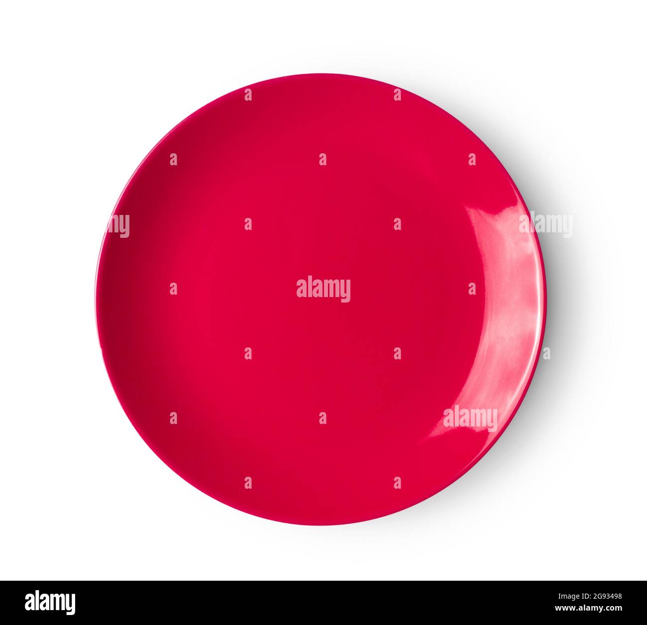 red ceramic plate on white background Stock Photo - Alamy