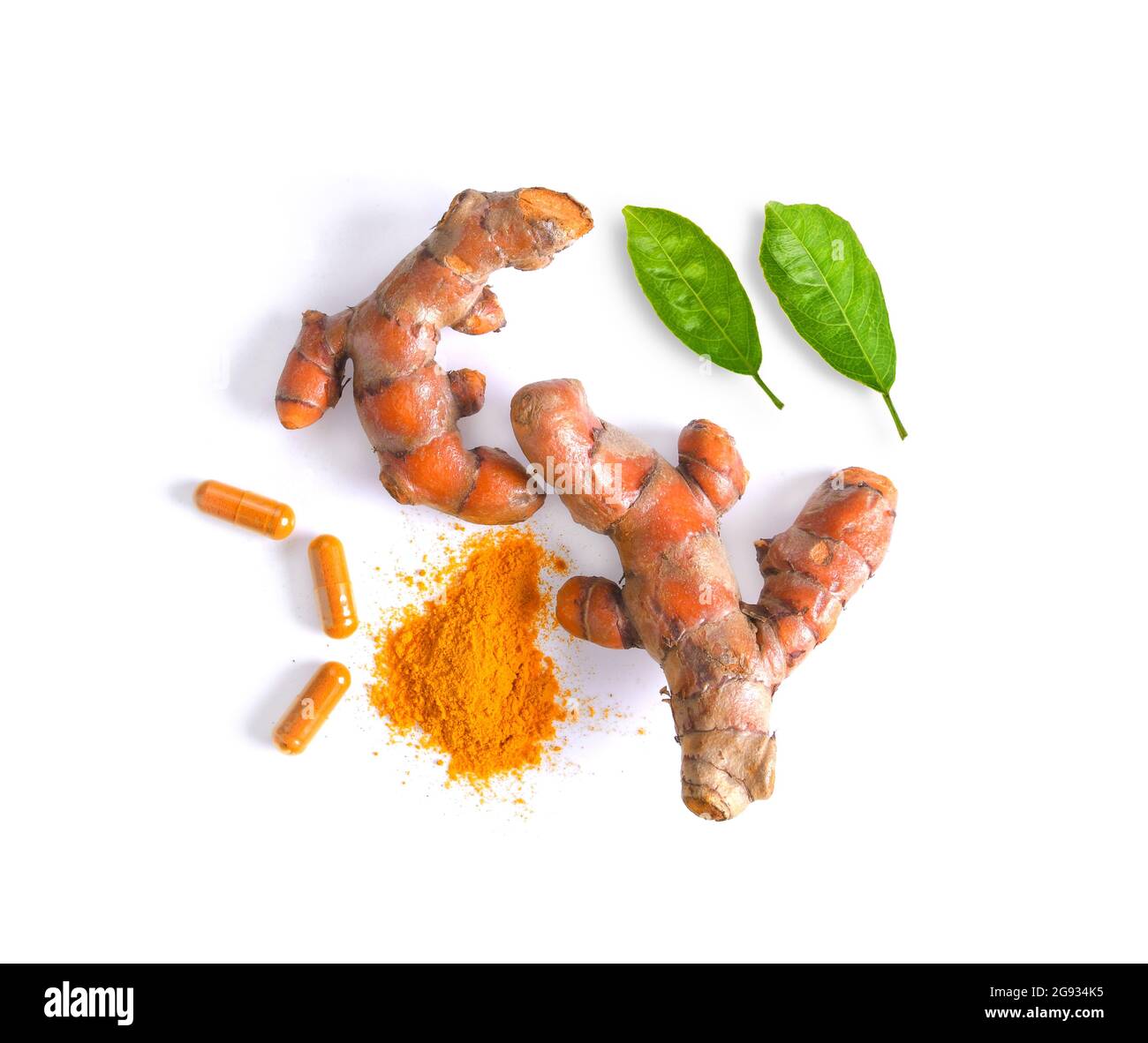 turmeric (Curcuma) powder pile with leaf isolated on white background ...