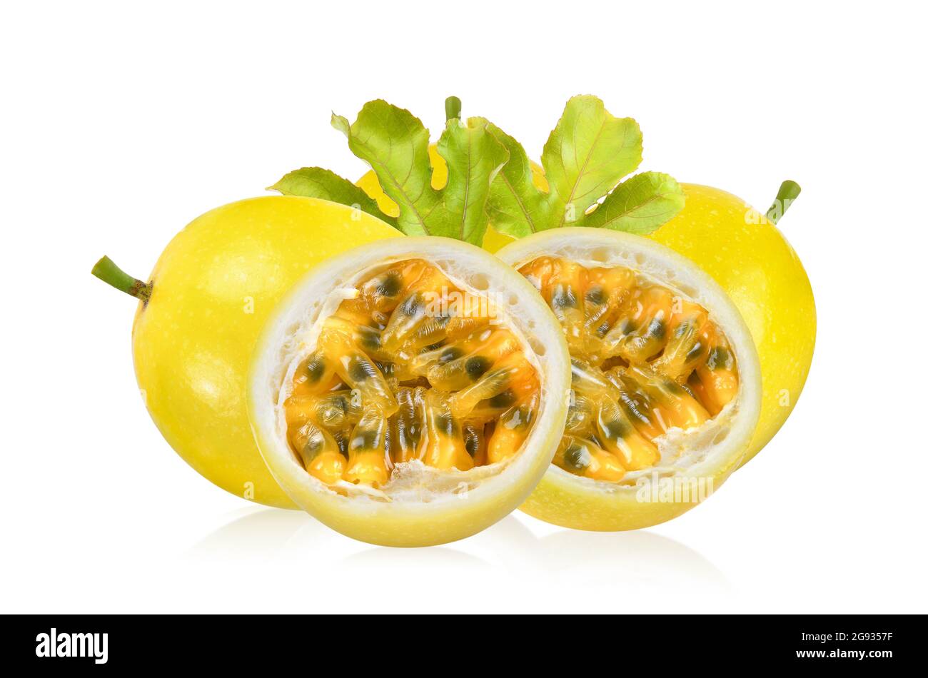 yellow passion fruit with leaf on white background Stock Photo - Alamy
