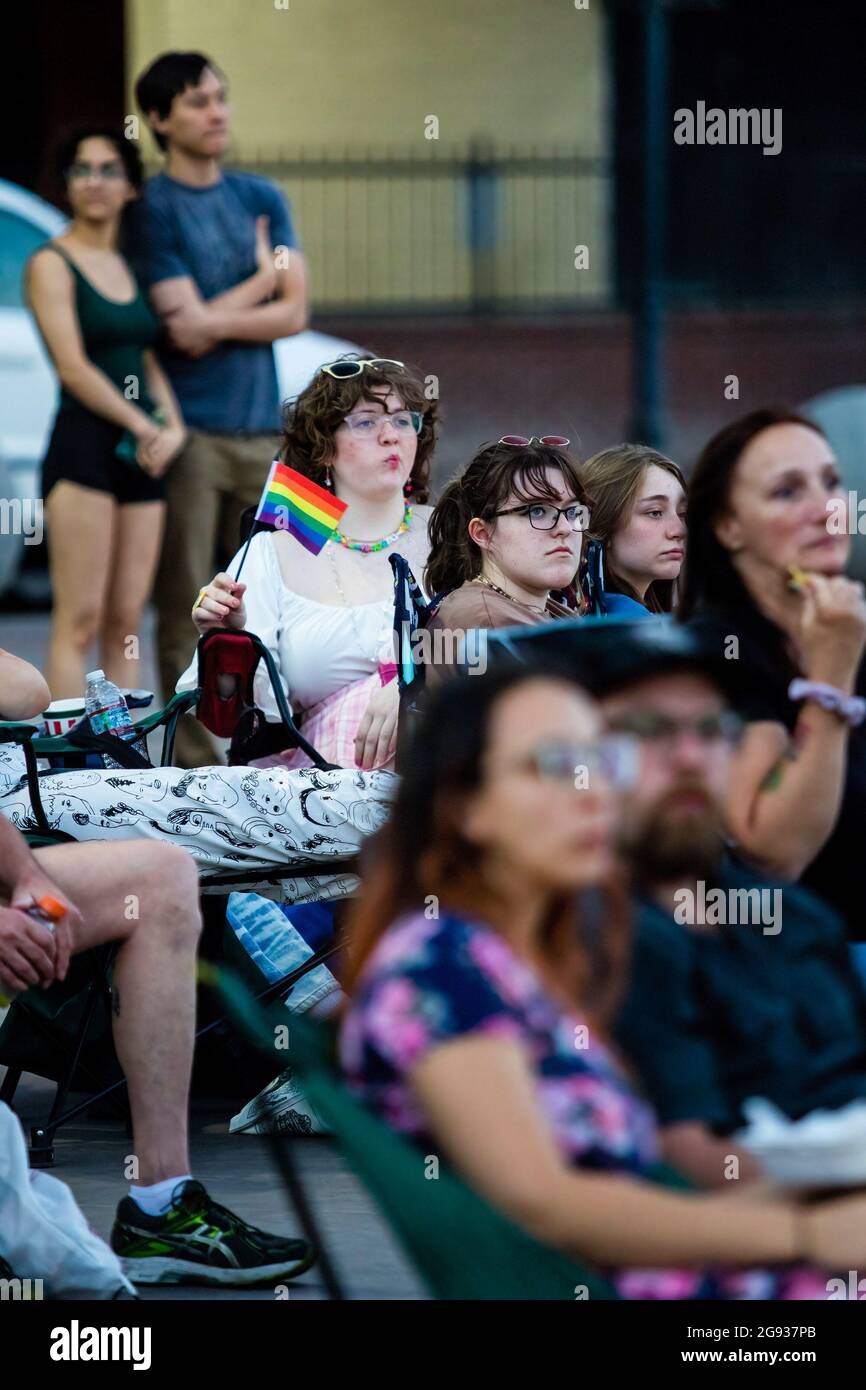 Pride event attendees get comfortable as they wait for "Rocky Horror ...