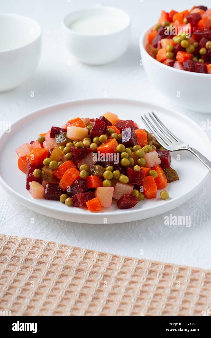 Traditional Russian lean vegetable salad vinaigrette in a white plate ...