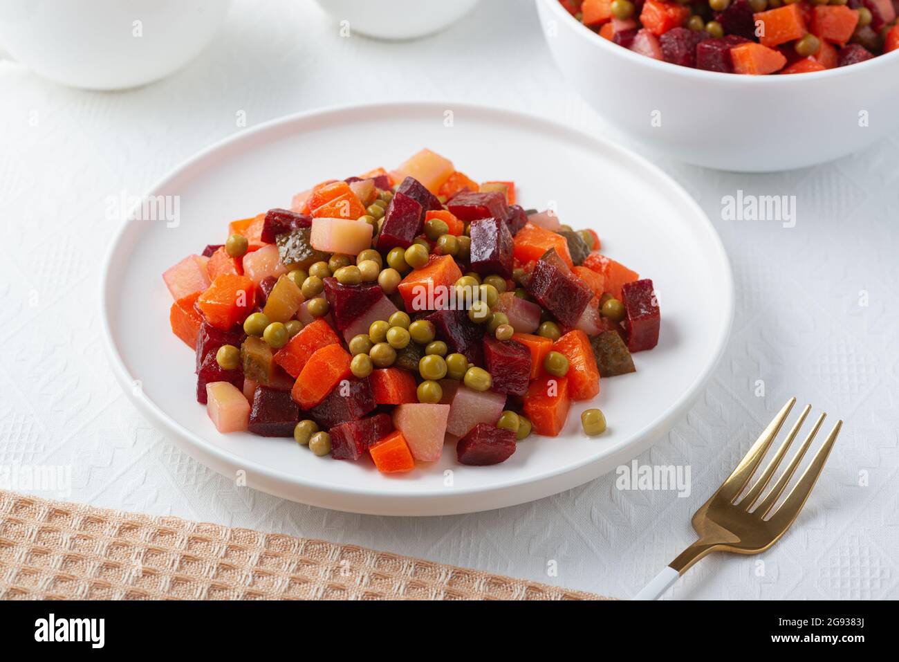 Traditional Russian lean vegetable salad vinaigrette in a white plate ...