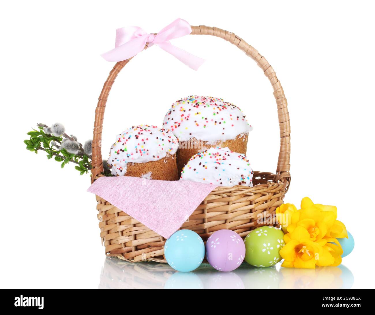 Beautiful Easter cakes in basket, colorful eggs and flowers isolated on ...