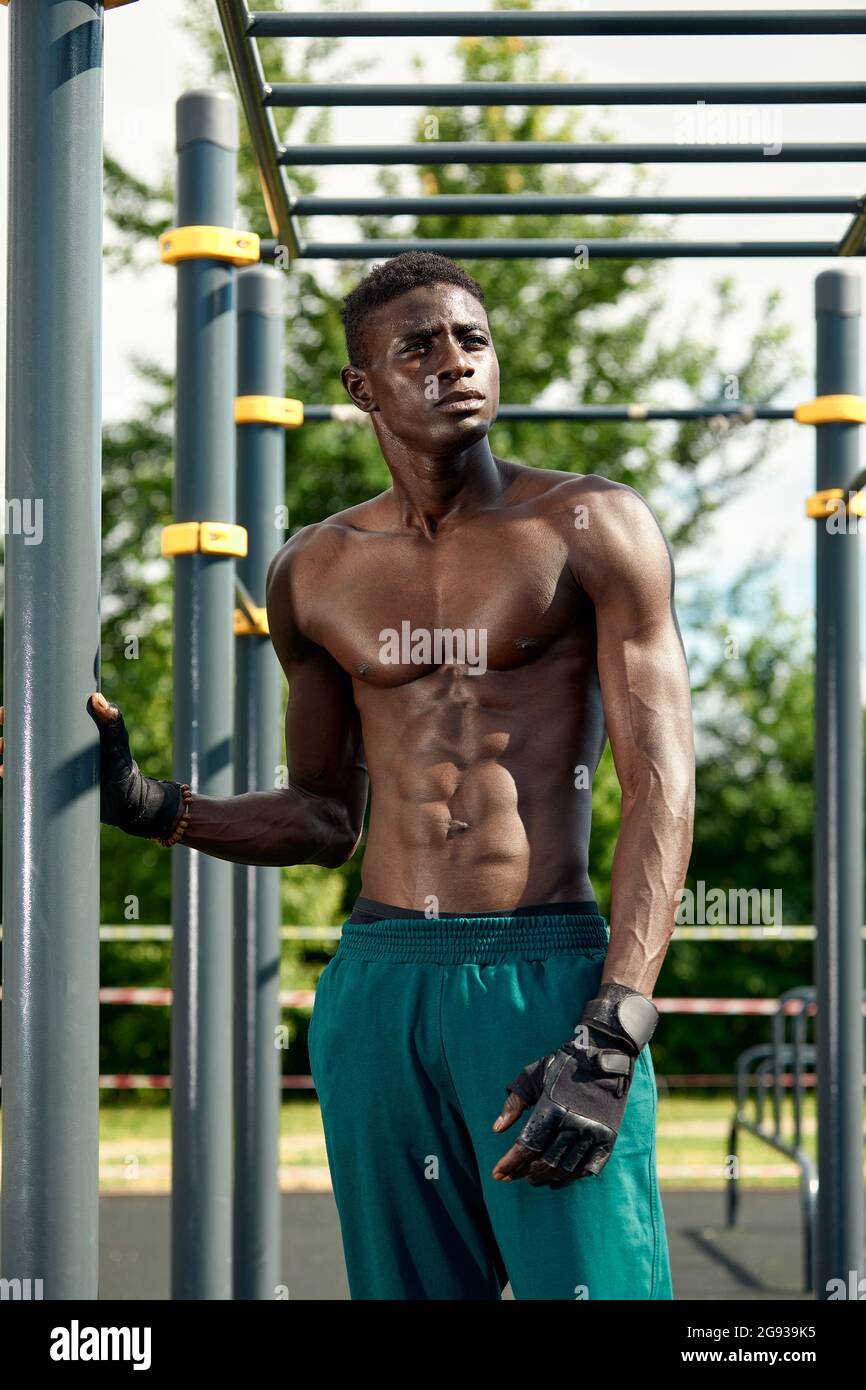 Athlete resting between outdoor exercises, outdoor exercise, African ...