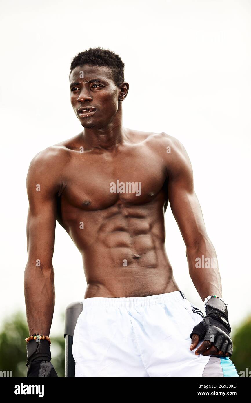 Athlete resting between outdoor exercises, outdoor exercise, African ...