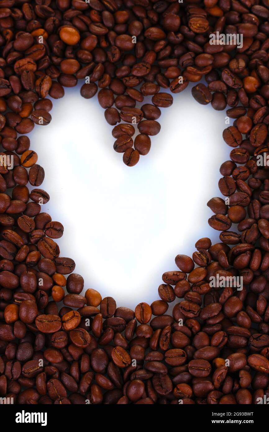 Pattern of heart on coffee beans background. Frame Stock Photo - Alamy