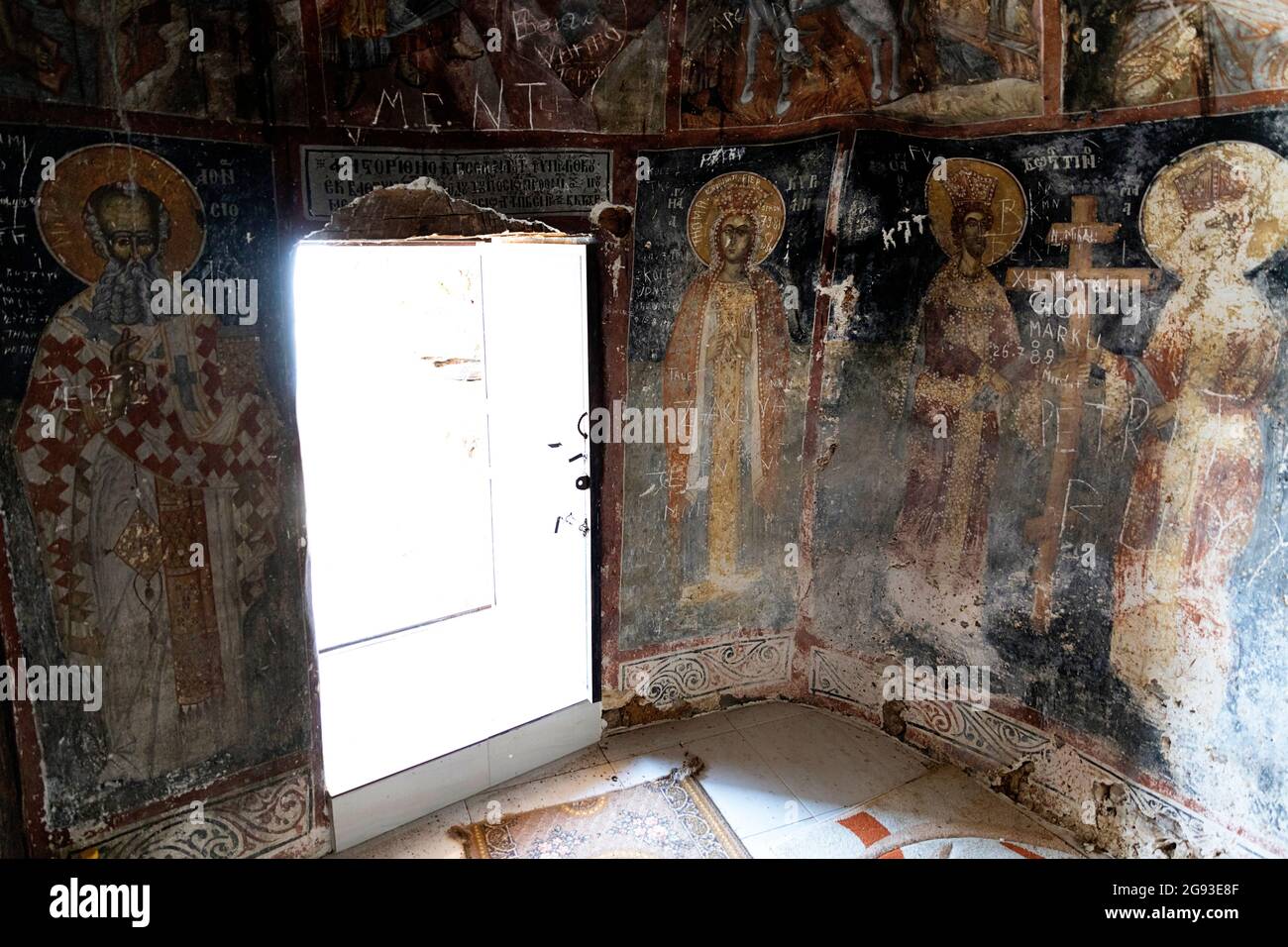 Icons, frescoes on the walls inside the amazing orthodox cave church ...