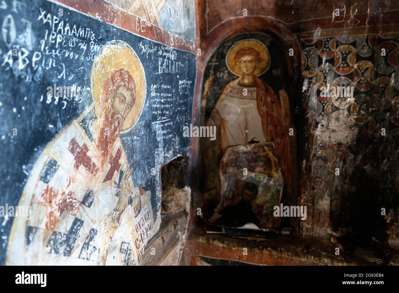 Icons, frescoes on the walls inside the amazing orthodox cave church ...