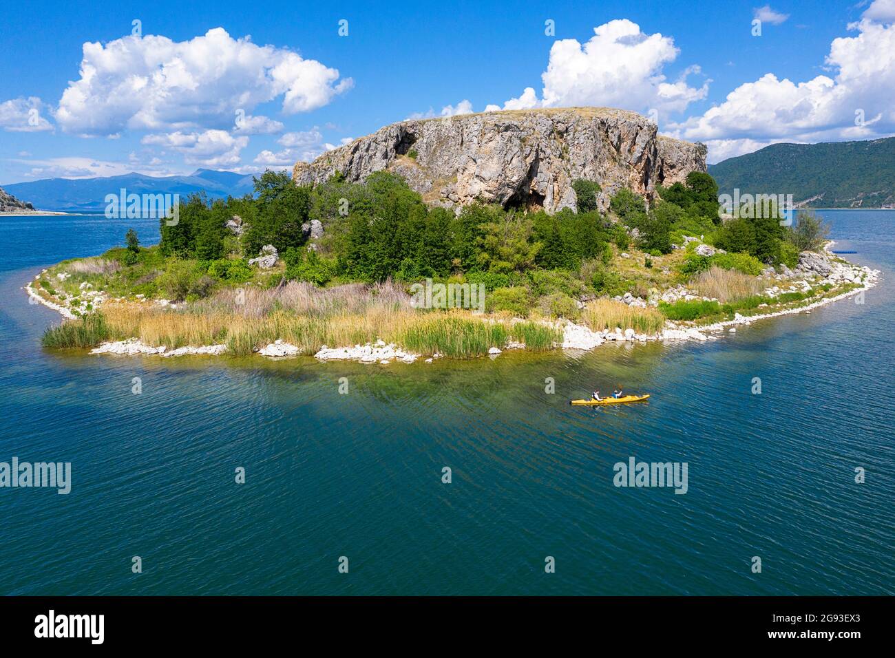 Aerial view of yellow kayak kayaking at Maligrad island on lake Prespa ...