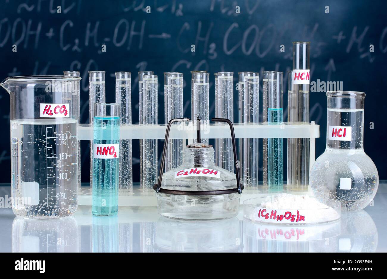 Test-tubes with various acids and other chemicals on the background of ...