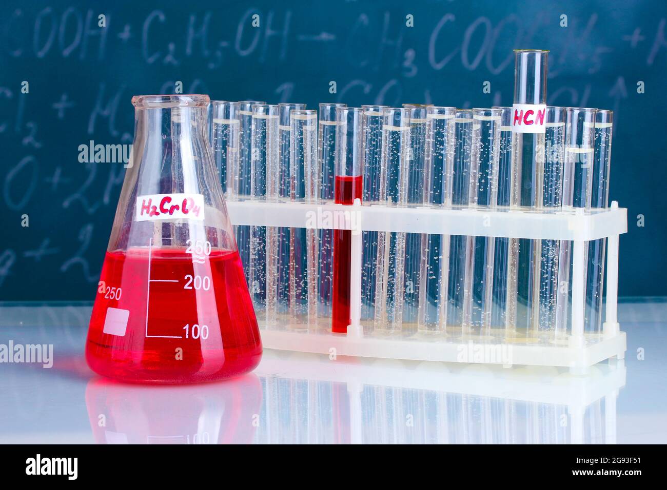 Test-tubes with various acids and other chemicals on the background of ...