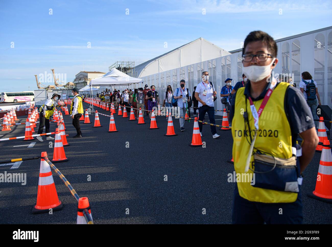 Journalists, media workers, photographers queue for the shuttle bus to ...
