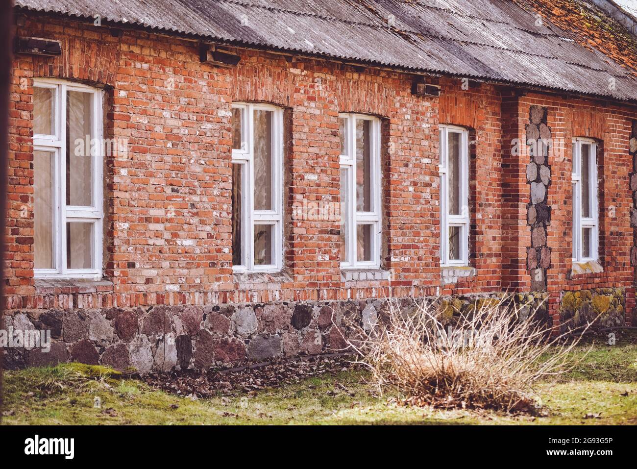 Facade of an old brick-stone house of ancient times Stock Photo - Alamy