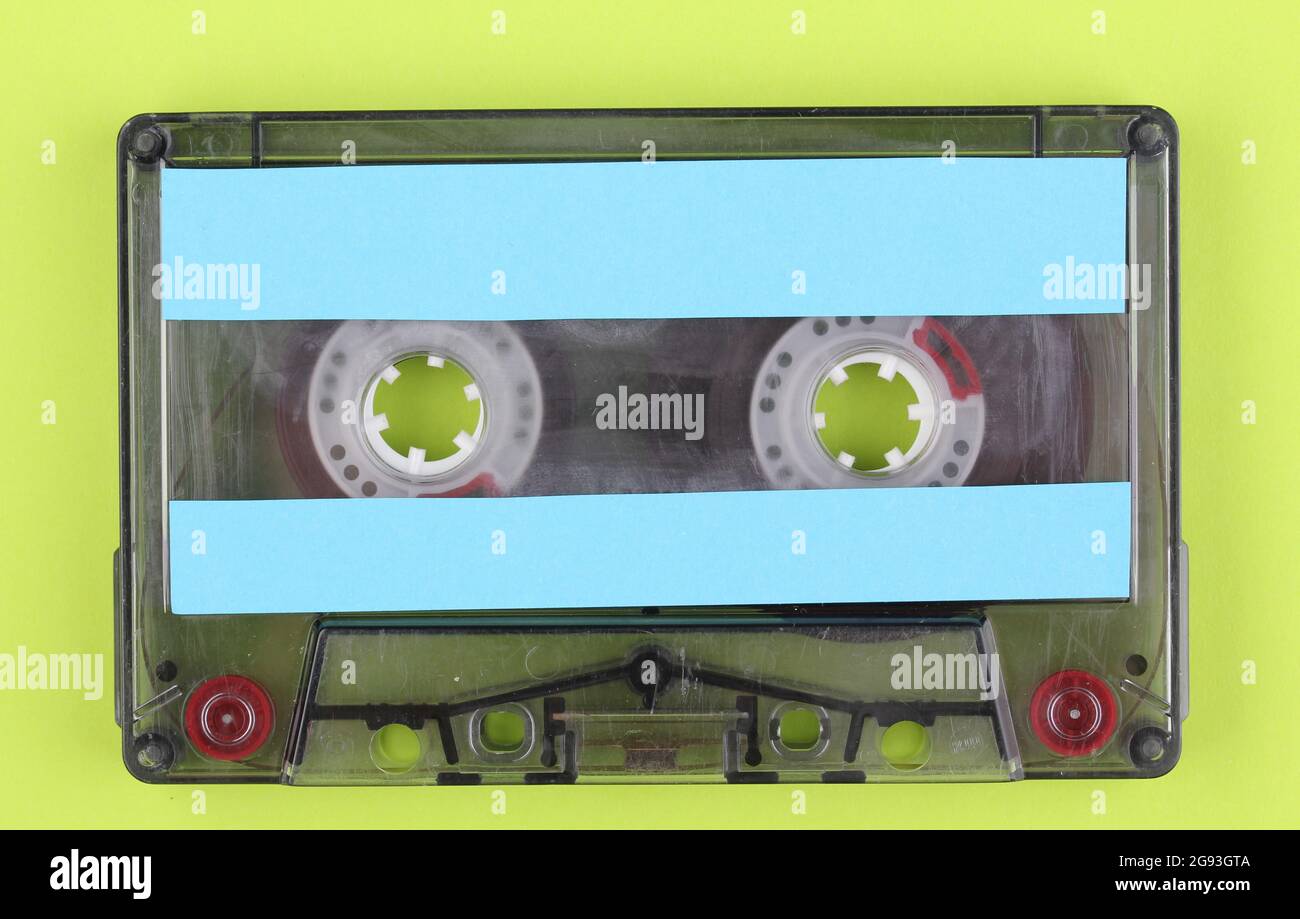 Audio cassette with color label on green background Stock Photo - Alamy