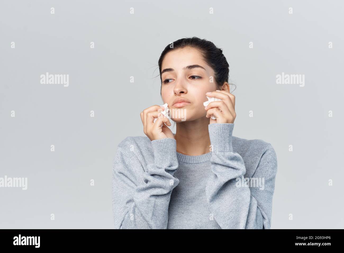 sick woman wiping face with handkerchief cold isolated background Stock ...