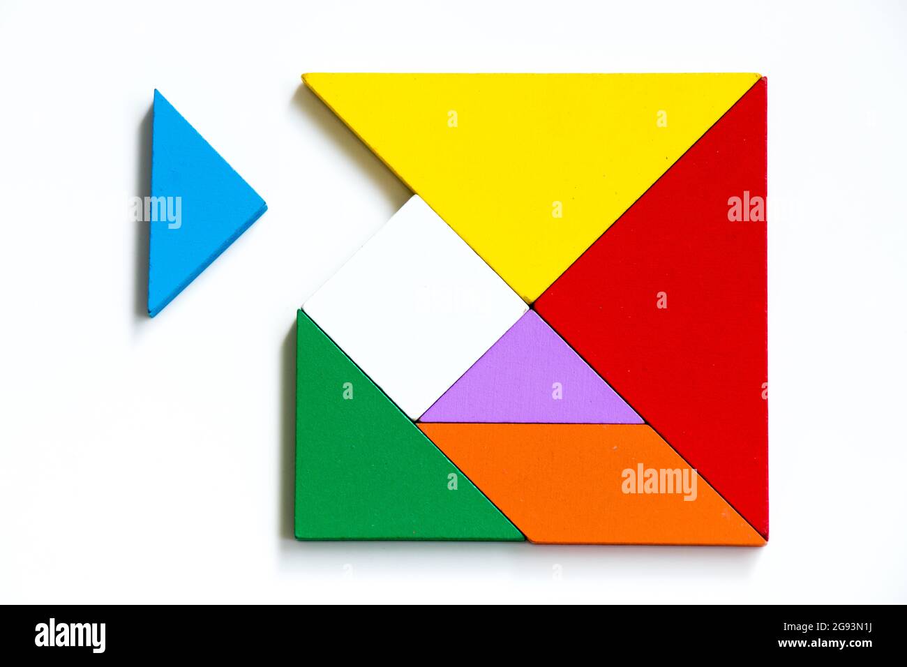 Colorful wood tangram puzzle in square shape that wait to complete on ...