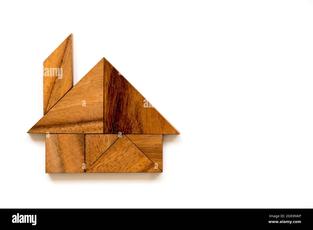 Wood tangram puzzle in home or house shape on white background Stock ...