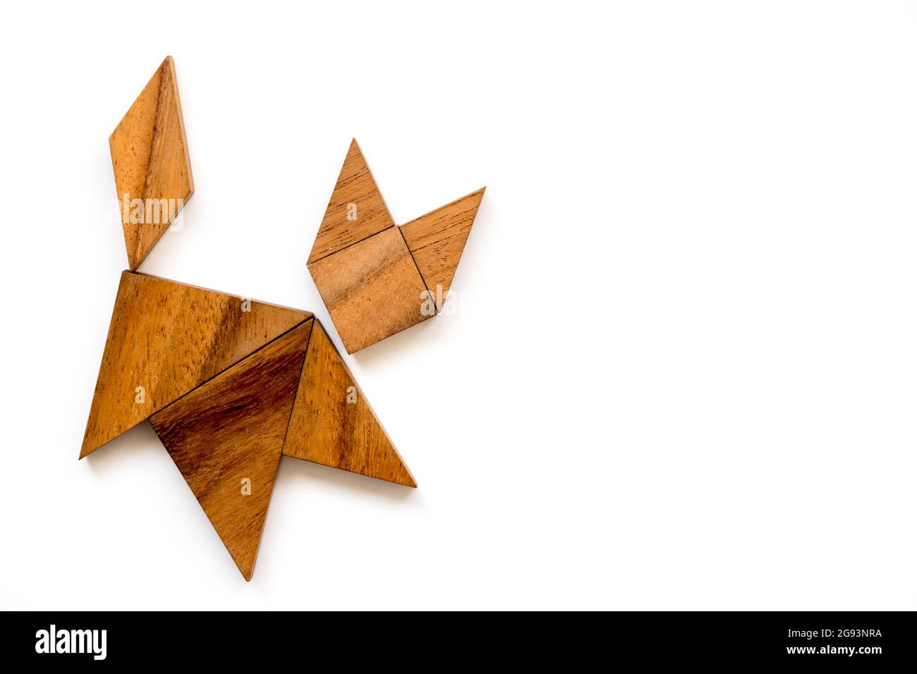 Wood tangram puzzle in cat shape on white background Stock Photo - Alamy