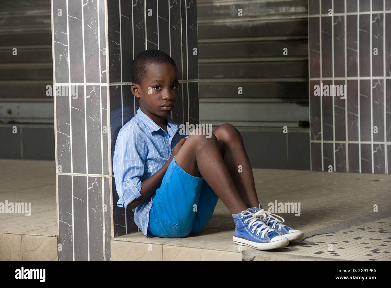 young homeless child who is afraid, is alone and has little hope for ...
