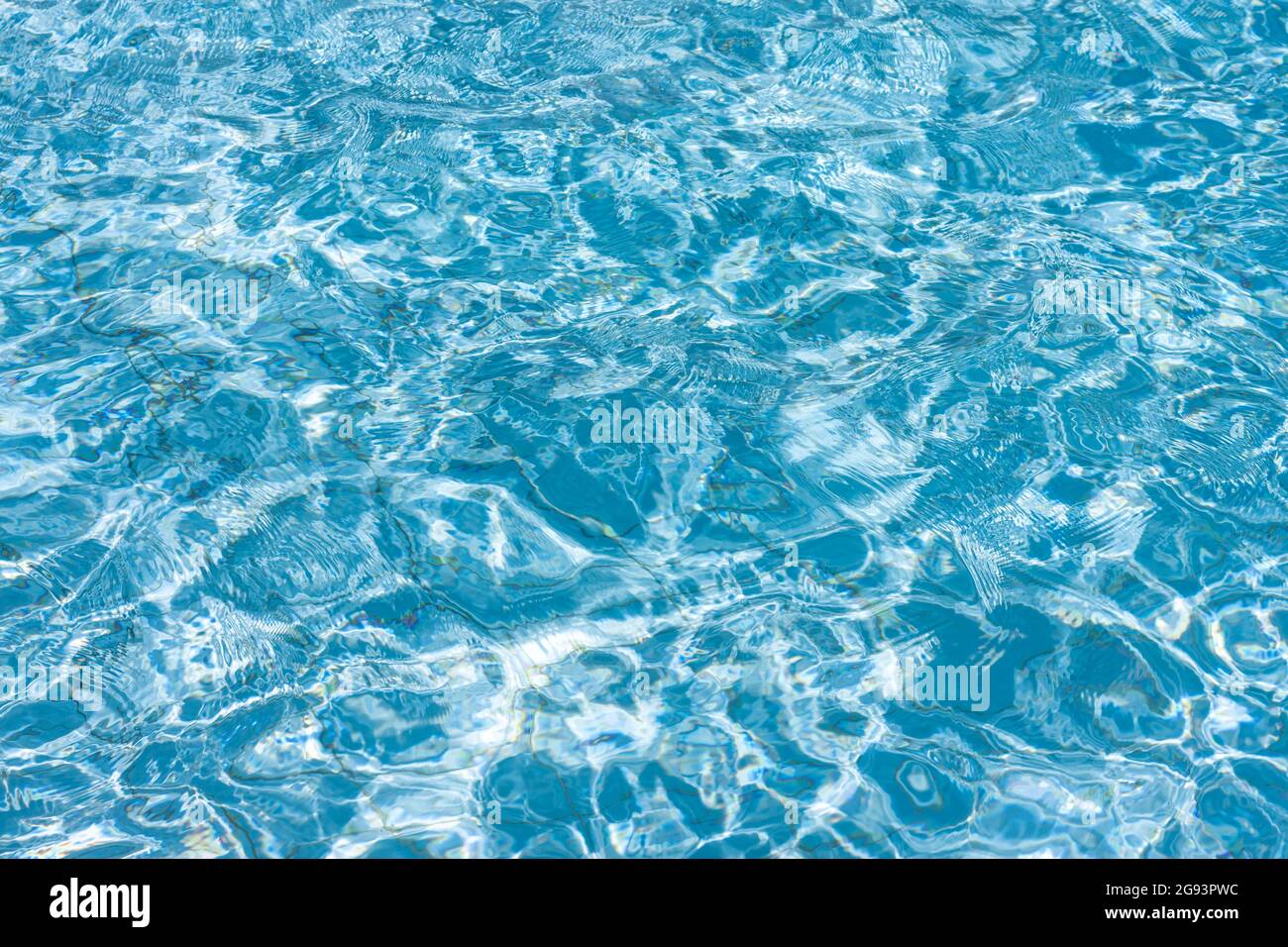 Ripple Water in swimming pool with sun reflection. Water background ...