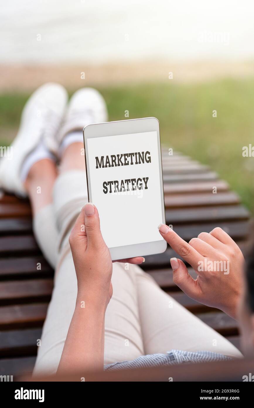 Text showing inspiration Marketing Strategy. Word for plan of action ...