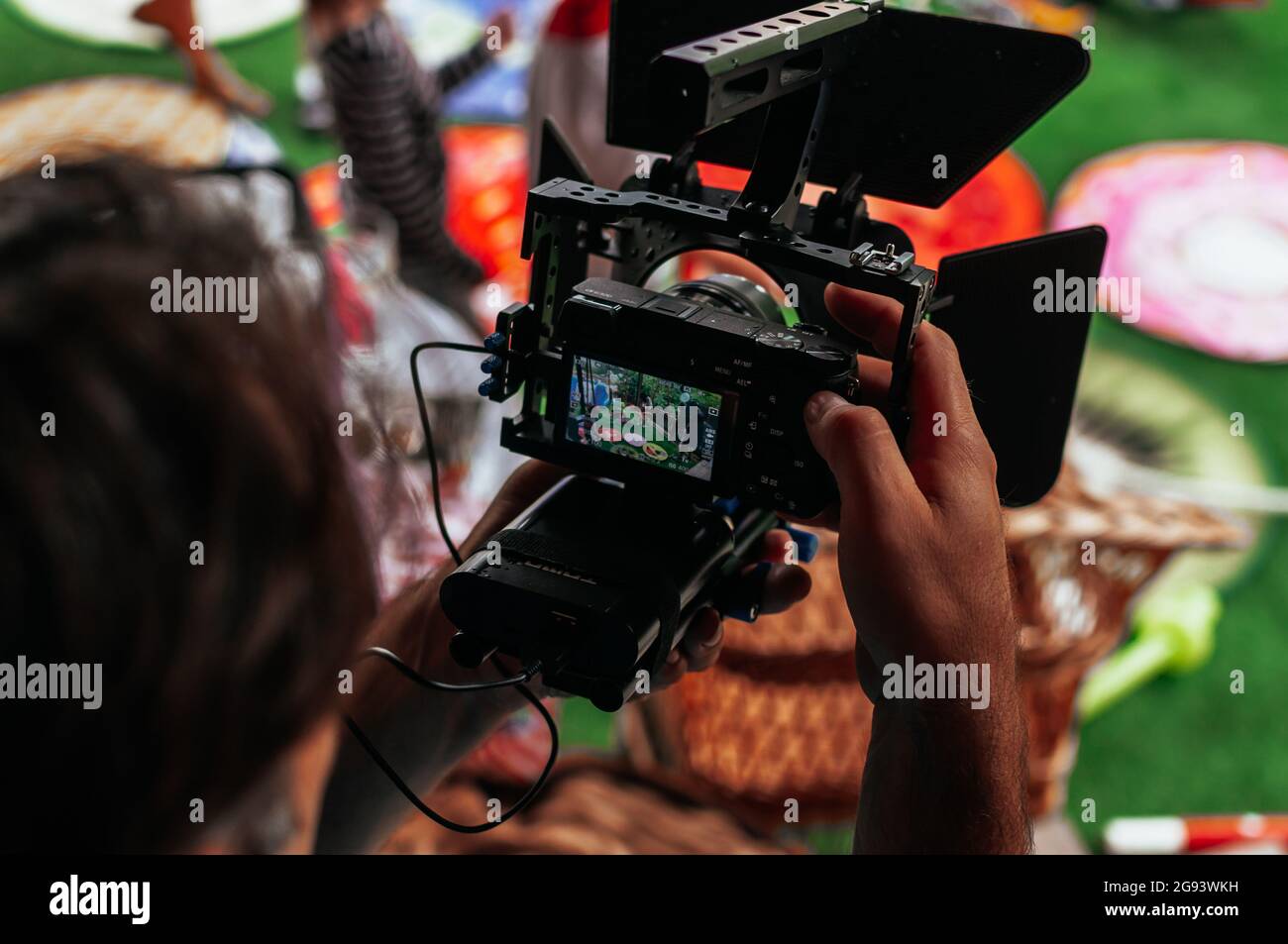 Operator filming an advertising scene Stock Photo - Alamy