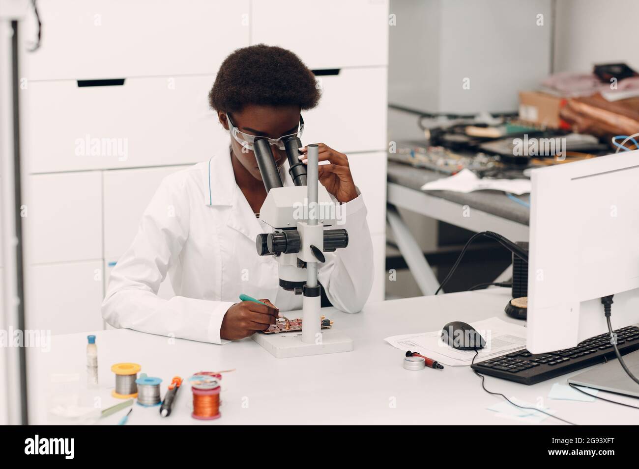 Scientist african american woman working in laboratory with electronic ...