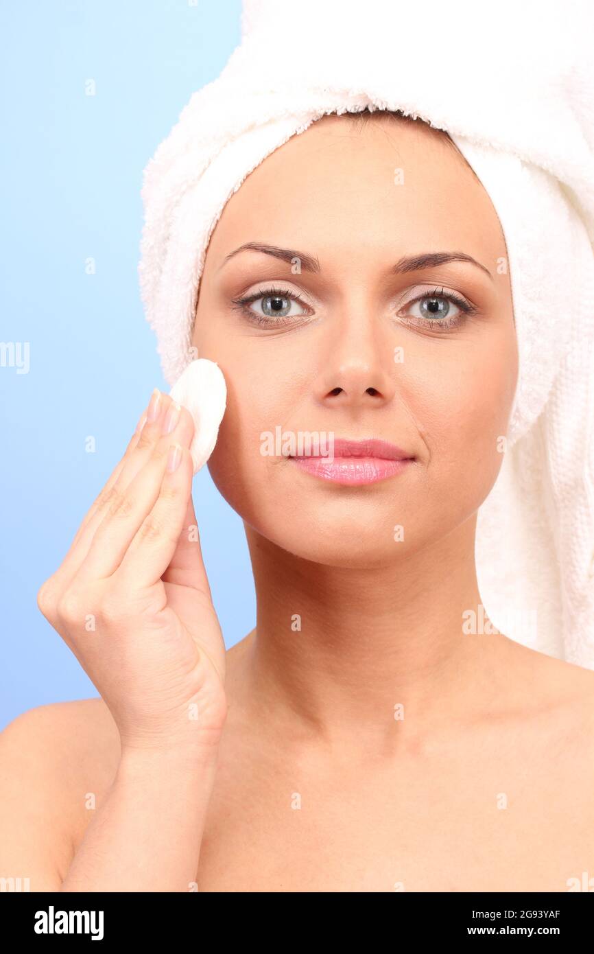 Beautiful Young Woman After Shower With A Towel On Her Head And A