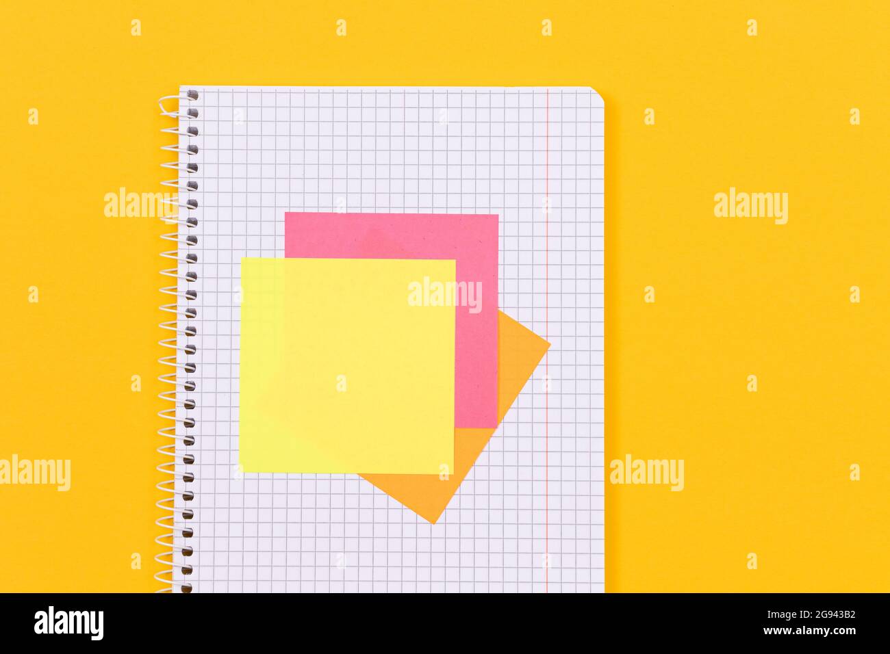 A Notepad with Sticky Notes Lying on Yellow Table - Blank Template. Top ...