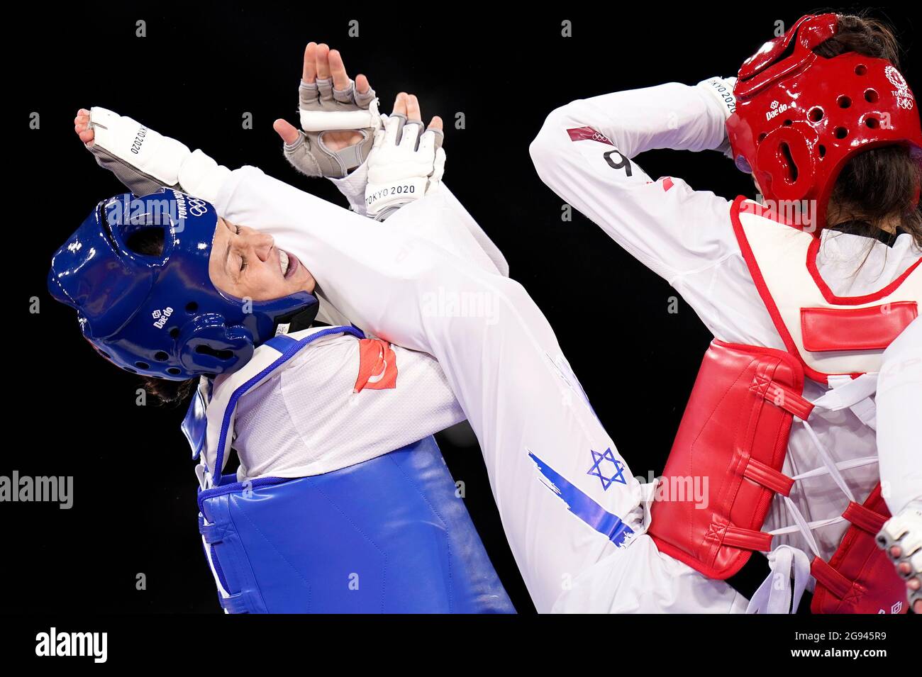 Turkey's Rukiye Yildirim (blue) competes against Israel's Avishag ...