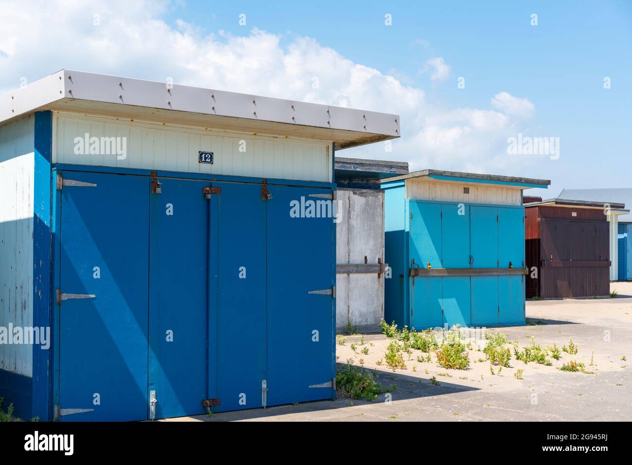 Landscape view of a line of beach huts, Sutton-on-Sea, Lincolnshire,UK ...