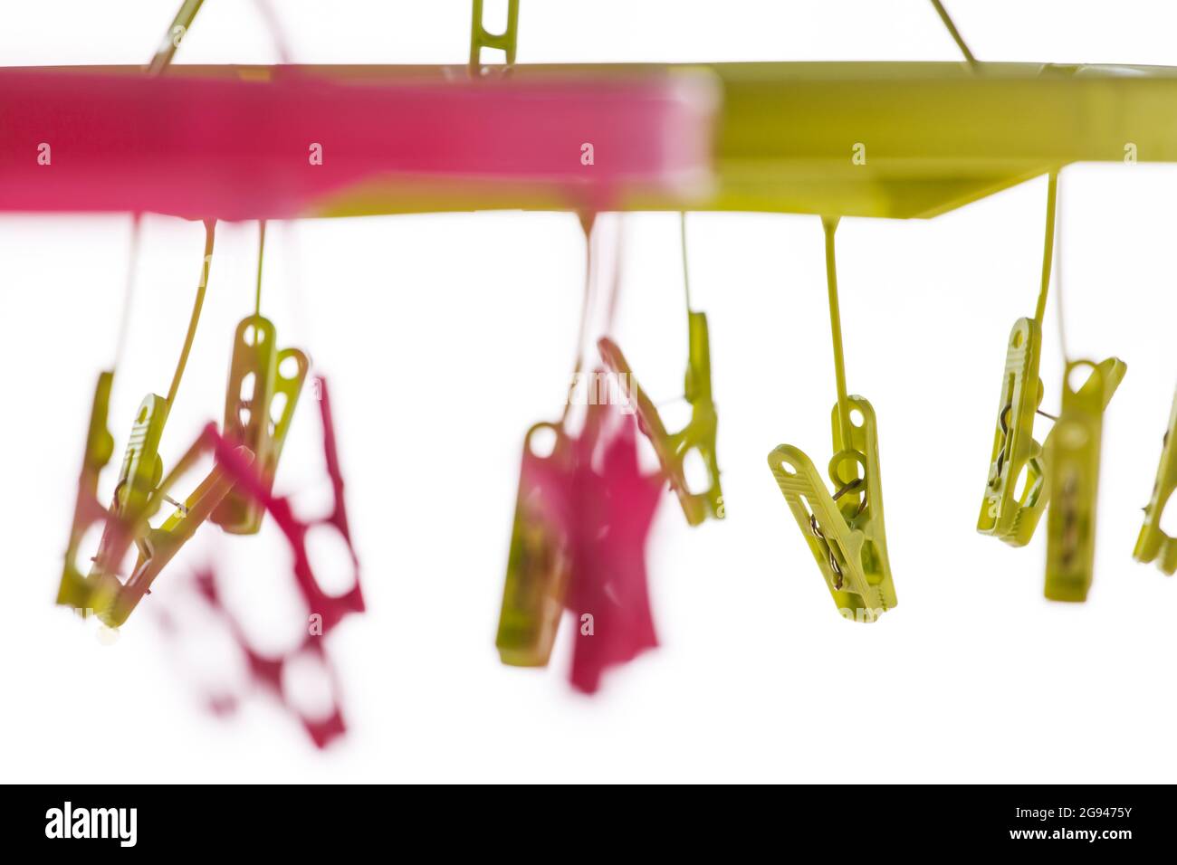 Bright color clip in coat hanger Stock Photo - Alamy