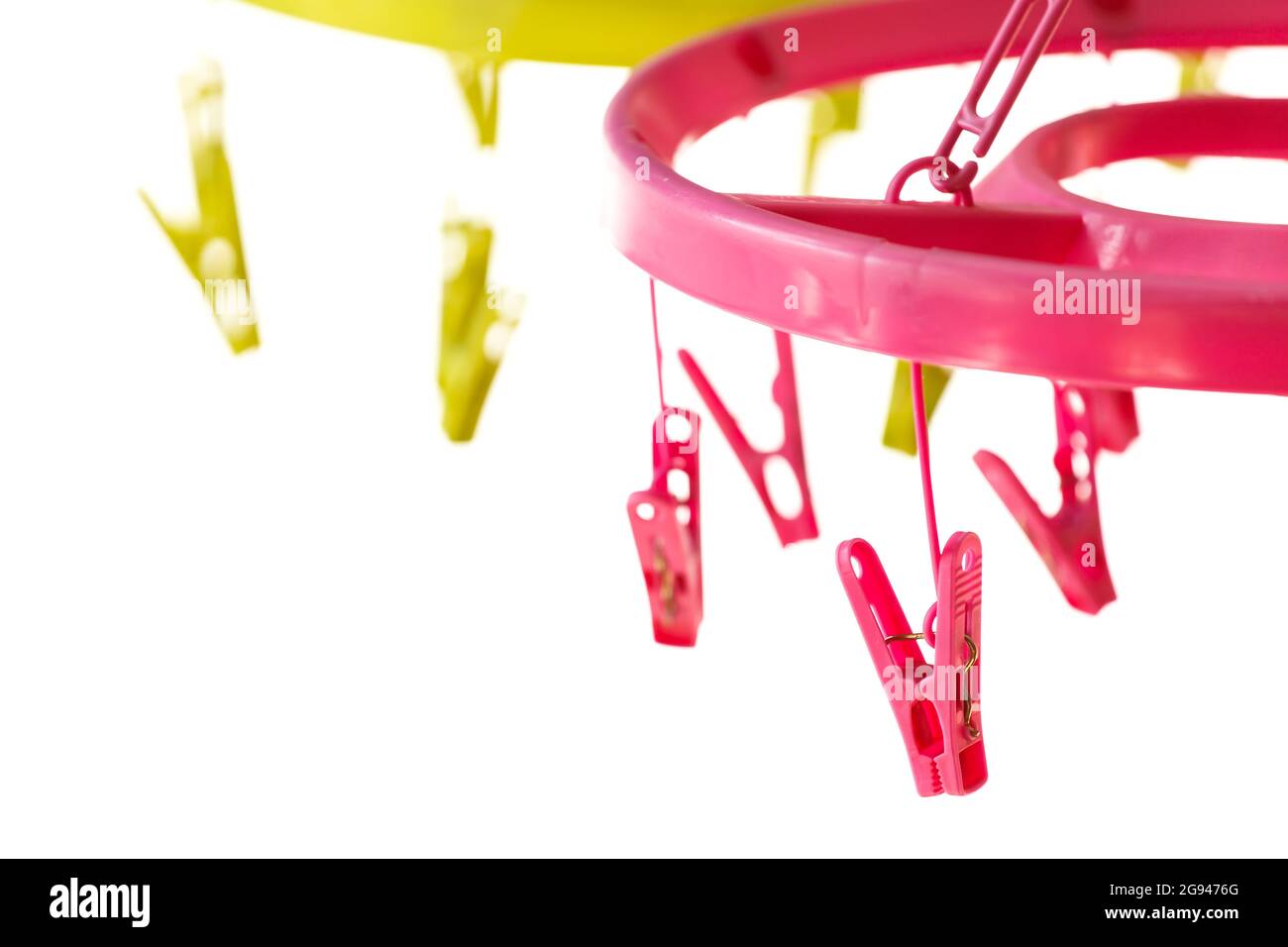 Bright color clip in coat hanger Stock Photo - Alamy