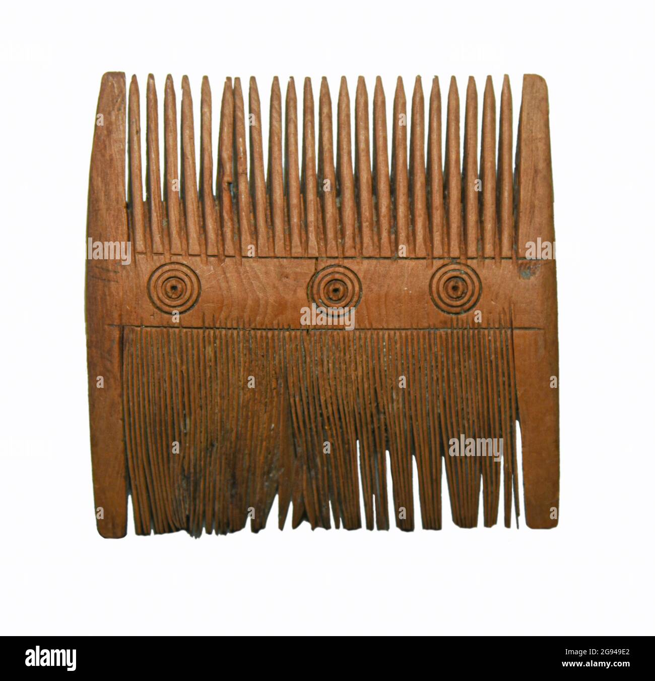 Ancient wooden comb with a pattern for combing hair, isolate Stock ...