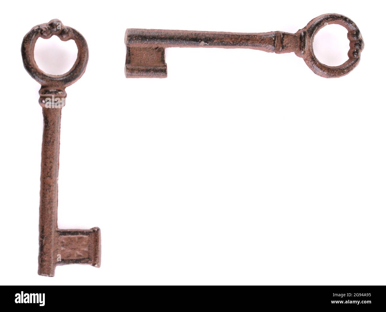 Two antique keys isolated on white Stock Photo - Alamy