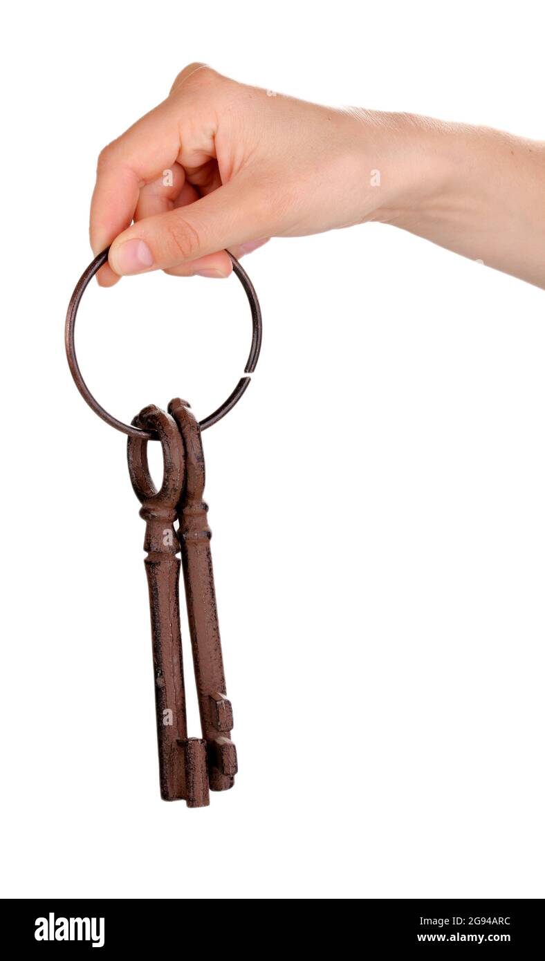 woman's hand holding a bunch of antique keys on white background Stock ...