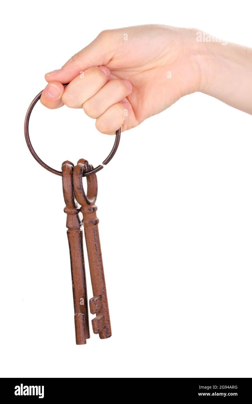 woman's hand holding a bunch of antique keys on white background Stock ...