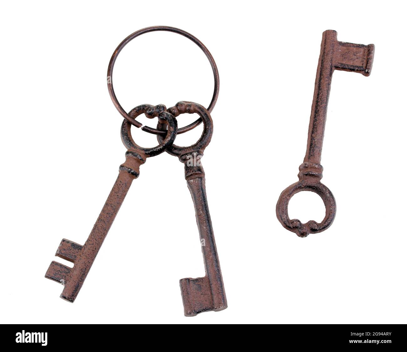 a bunch of antique keys and one single key isolated on white Stock ...