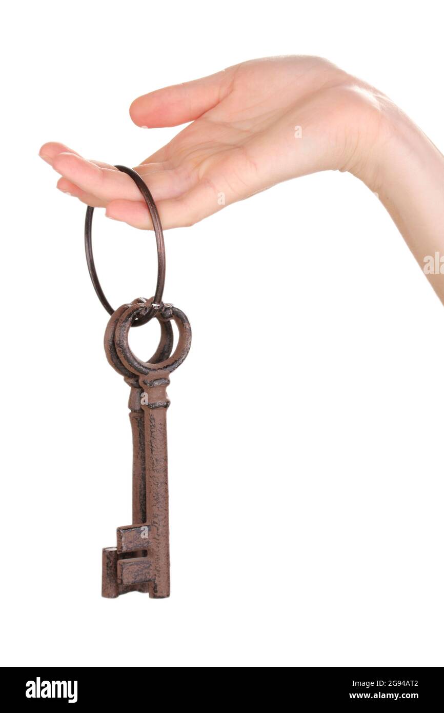 woman's hand holding a bunch of antique keys on white background Stock ...