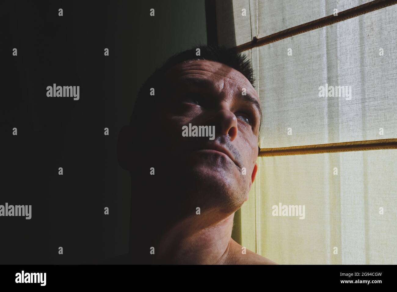man thinking in the shadows Stock Photo - Alamy
