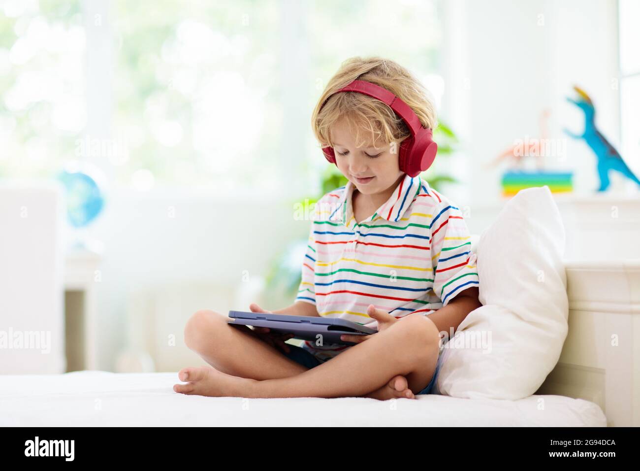 Child with tablet computer. Kids study online. Electronic device for ...