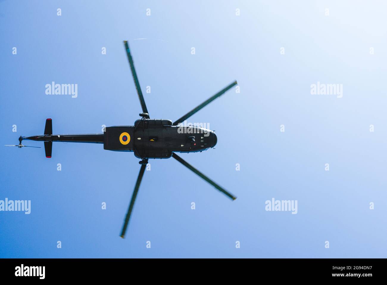 military helicopter flying seen from below Stock Photo - Alamy