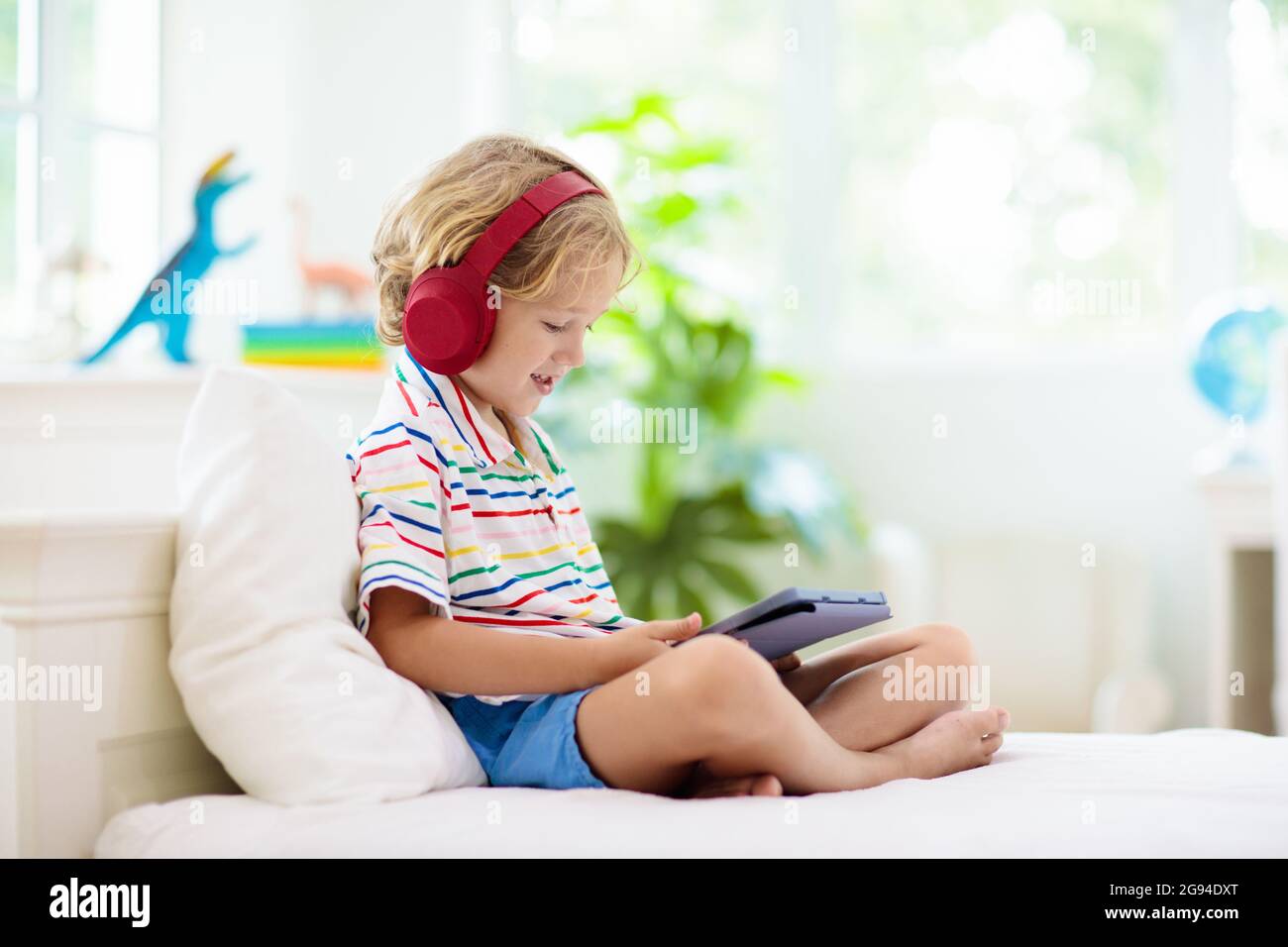 Child with tablet computer. Kids study online. Electronic device for ...