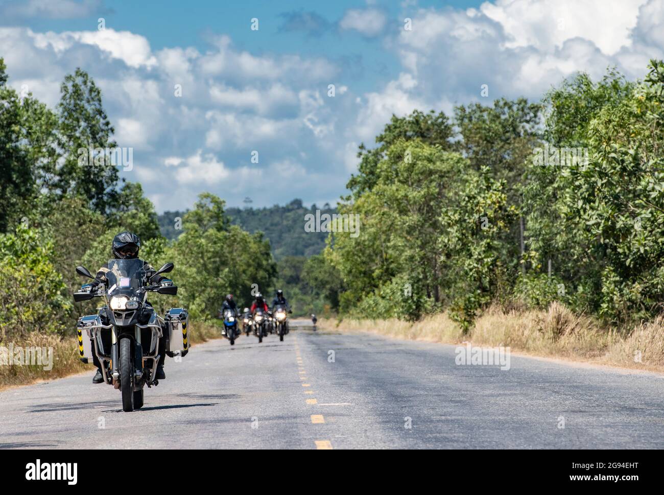 Men riding their adventure motorbikes on country road in Cambodia Stock ...