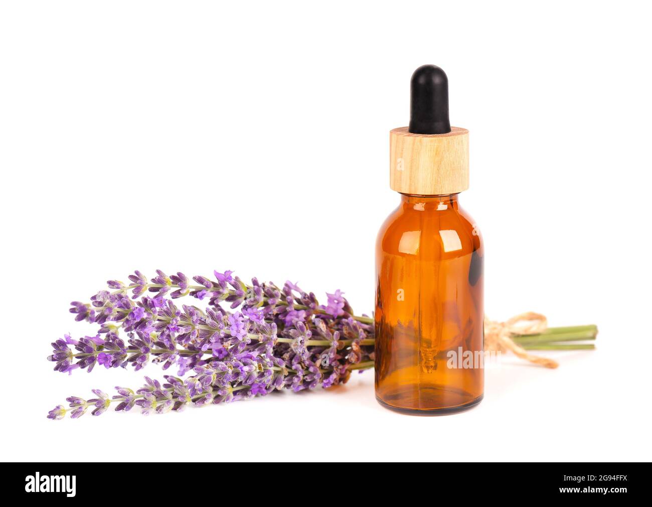 Lavender flowers with glass bottle for essential oil, isolated on white ...