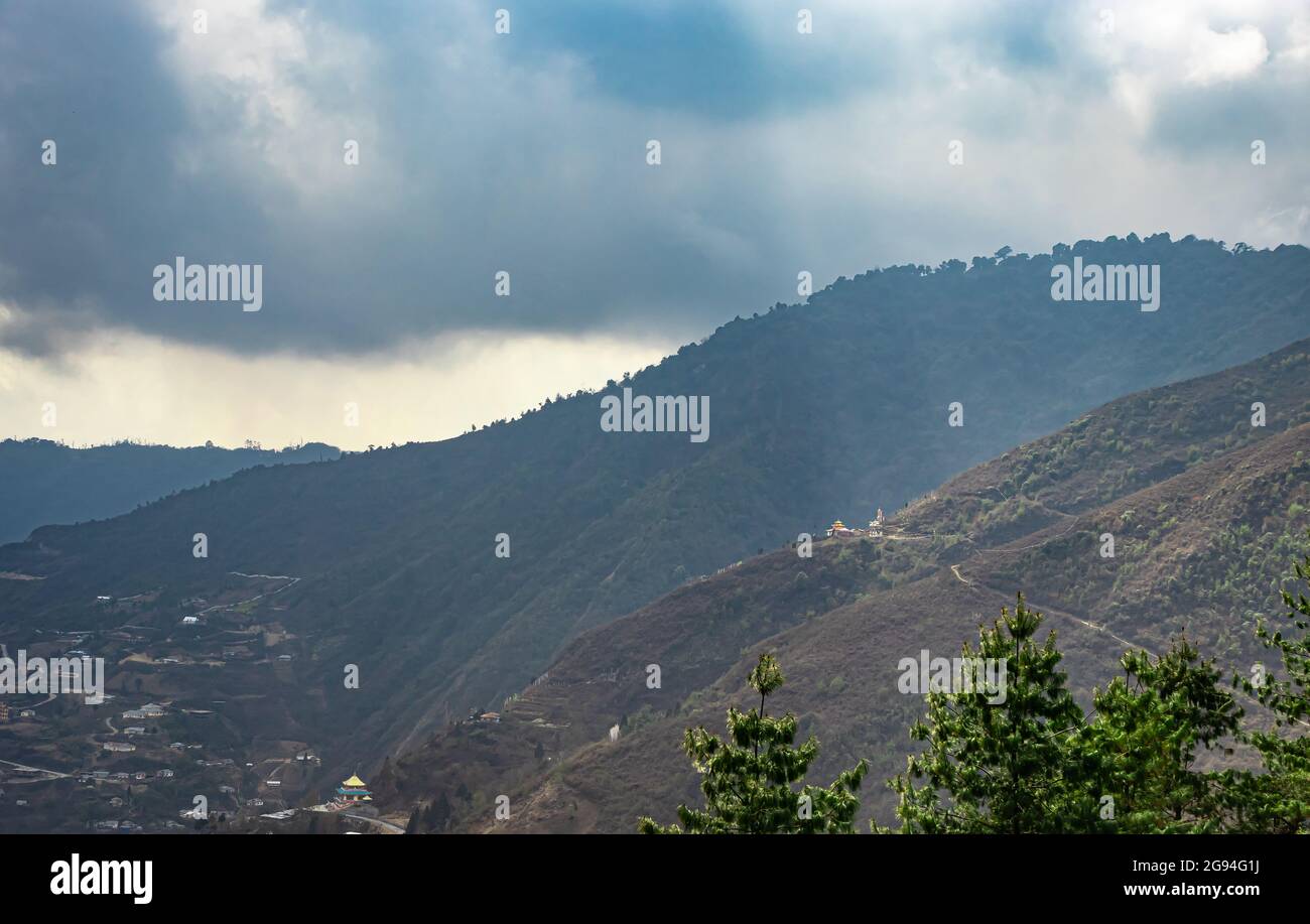Buddhist monastery situated at mountain foothill at evening image is ...